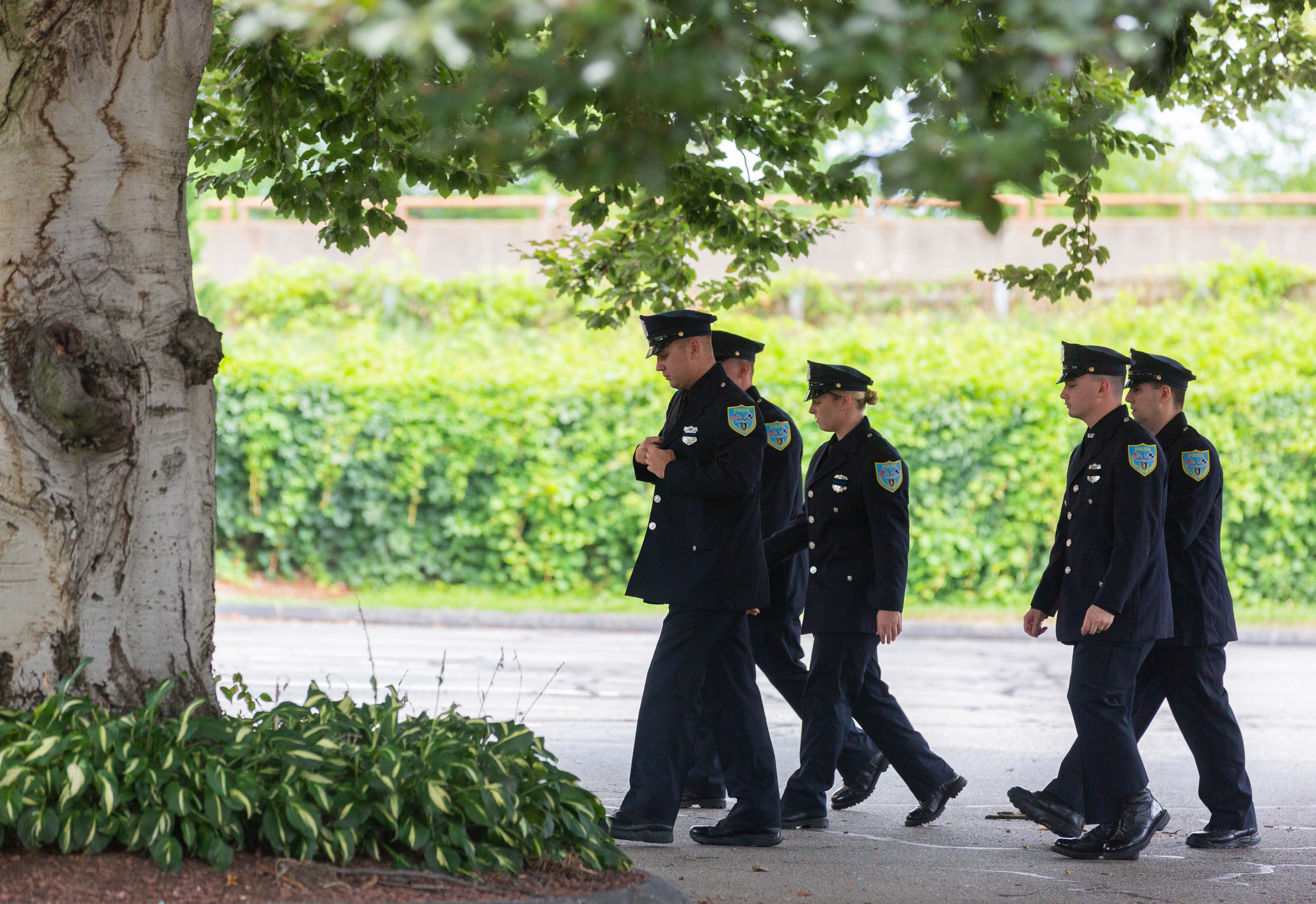 Springfield police escorted the body of deceased officer Aaron McNab ...