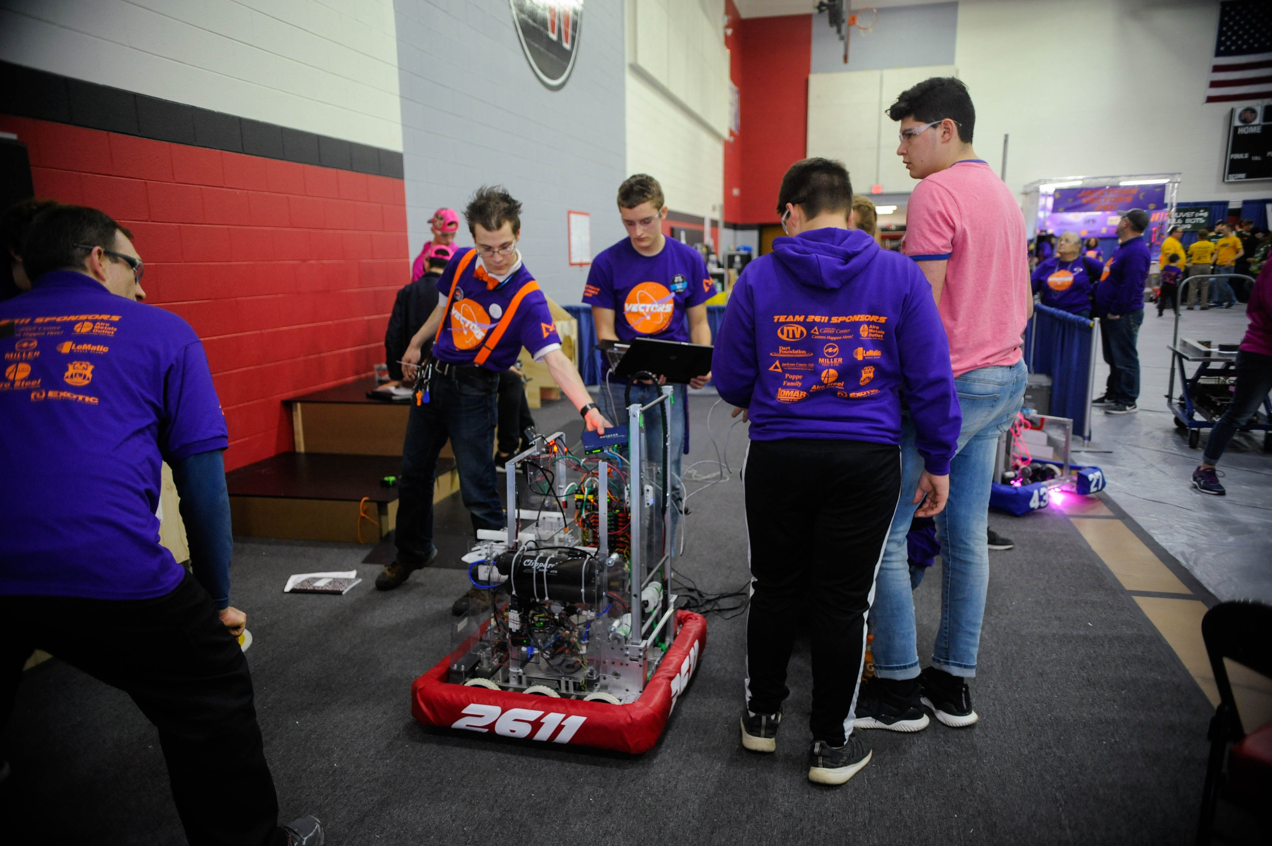 Schools from around Michigan compete in FIRST district robotics ...
