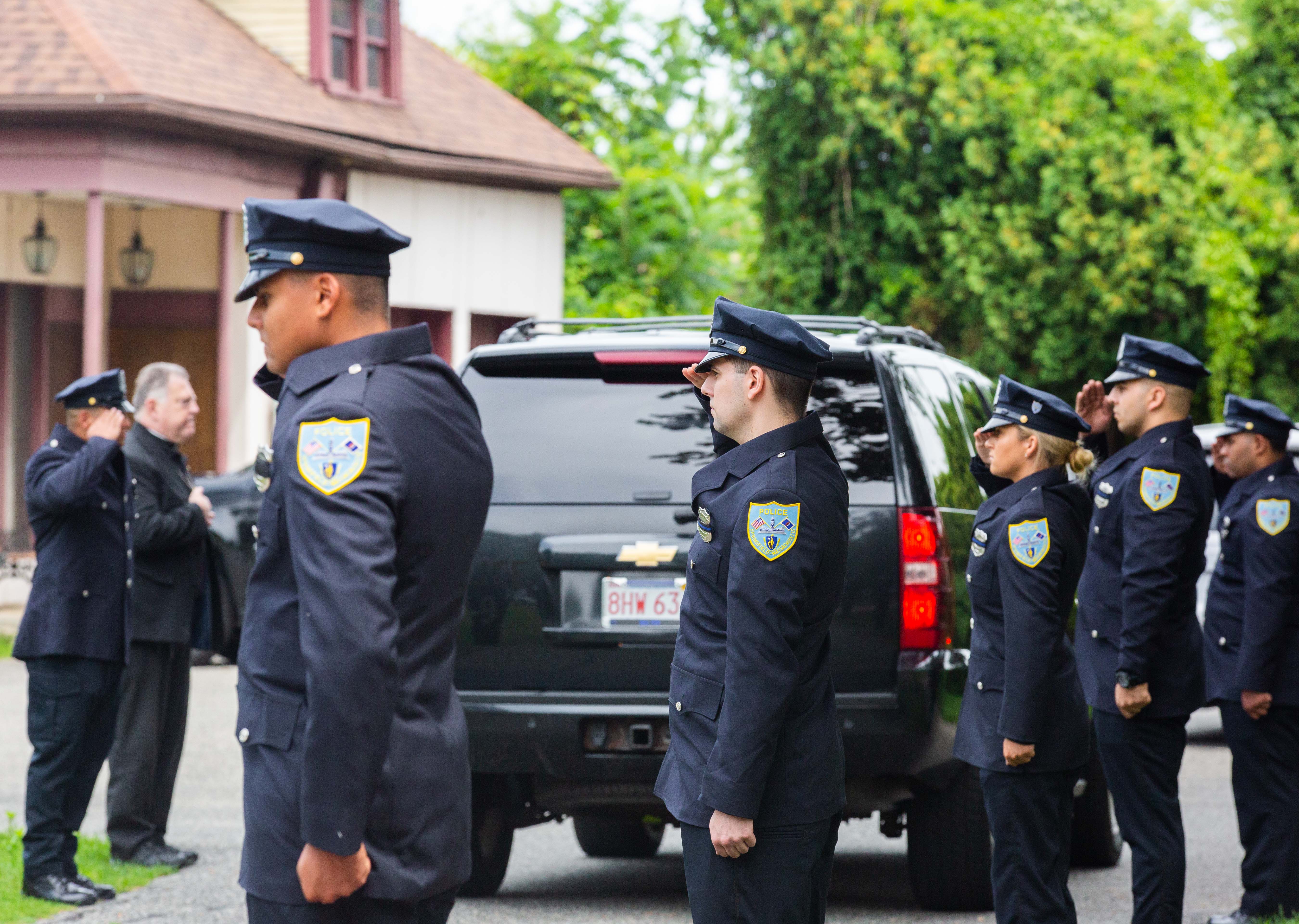 Springfield police escorted the body of deceased officer Aaron McNab ...