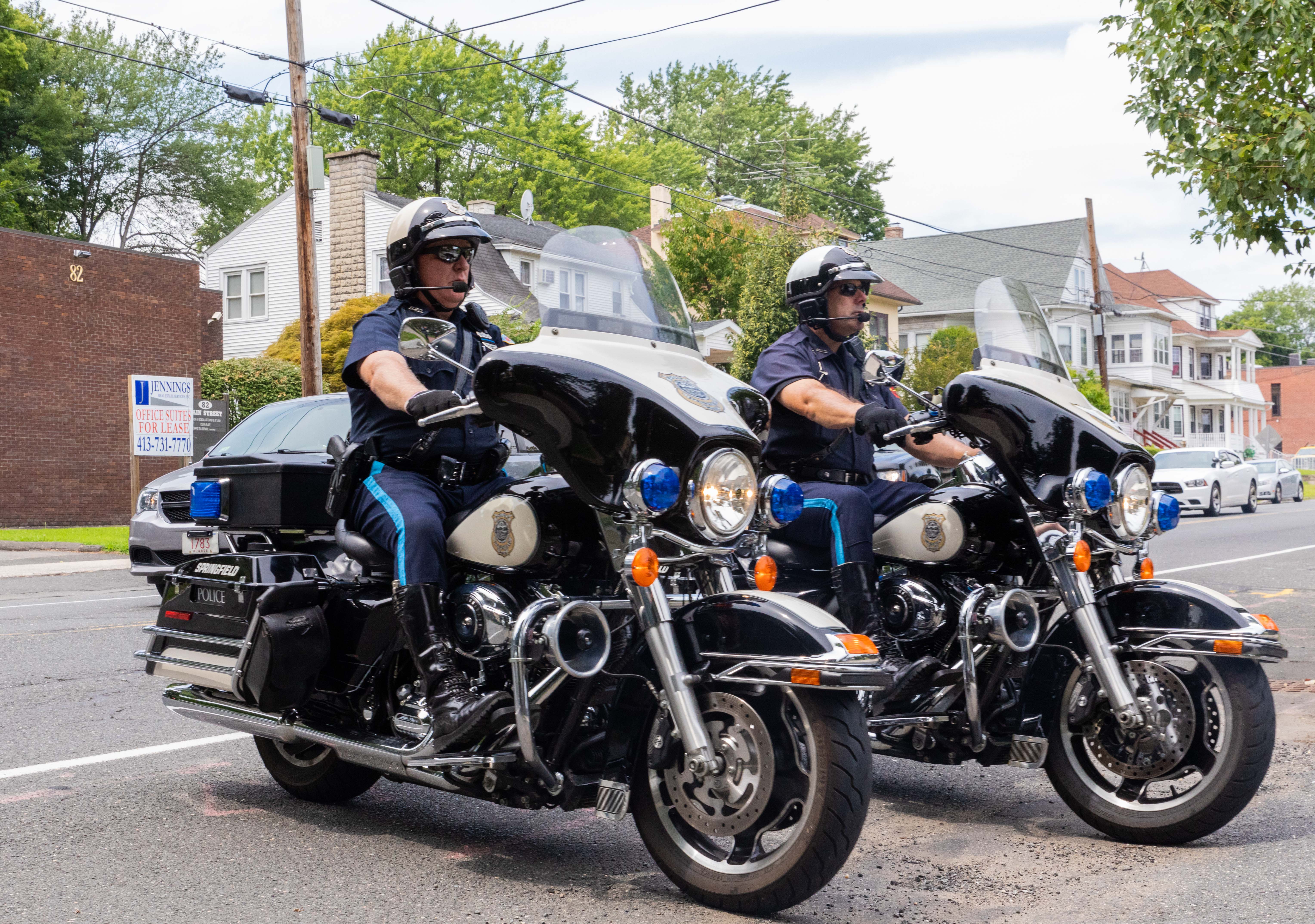 Springfield police escorted the body of deceased officer Aaron McNab ...