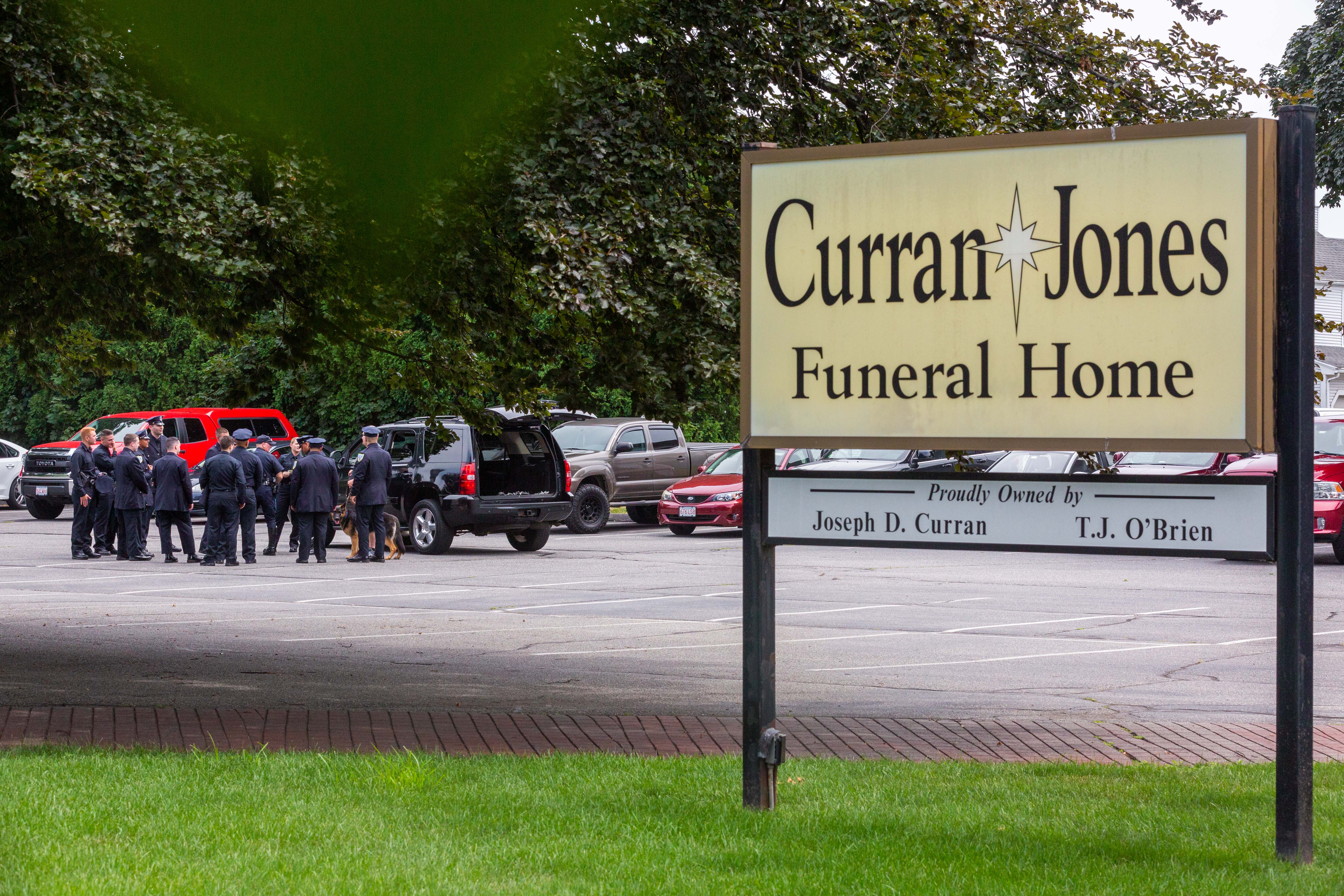 Springfield police escorted the body of deceased officer Aaron McNab ...