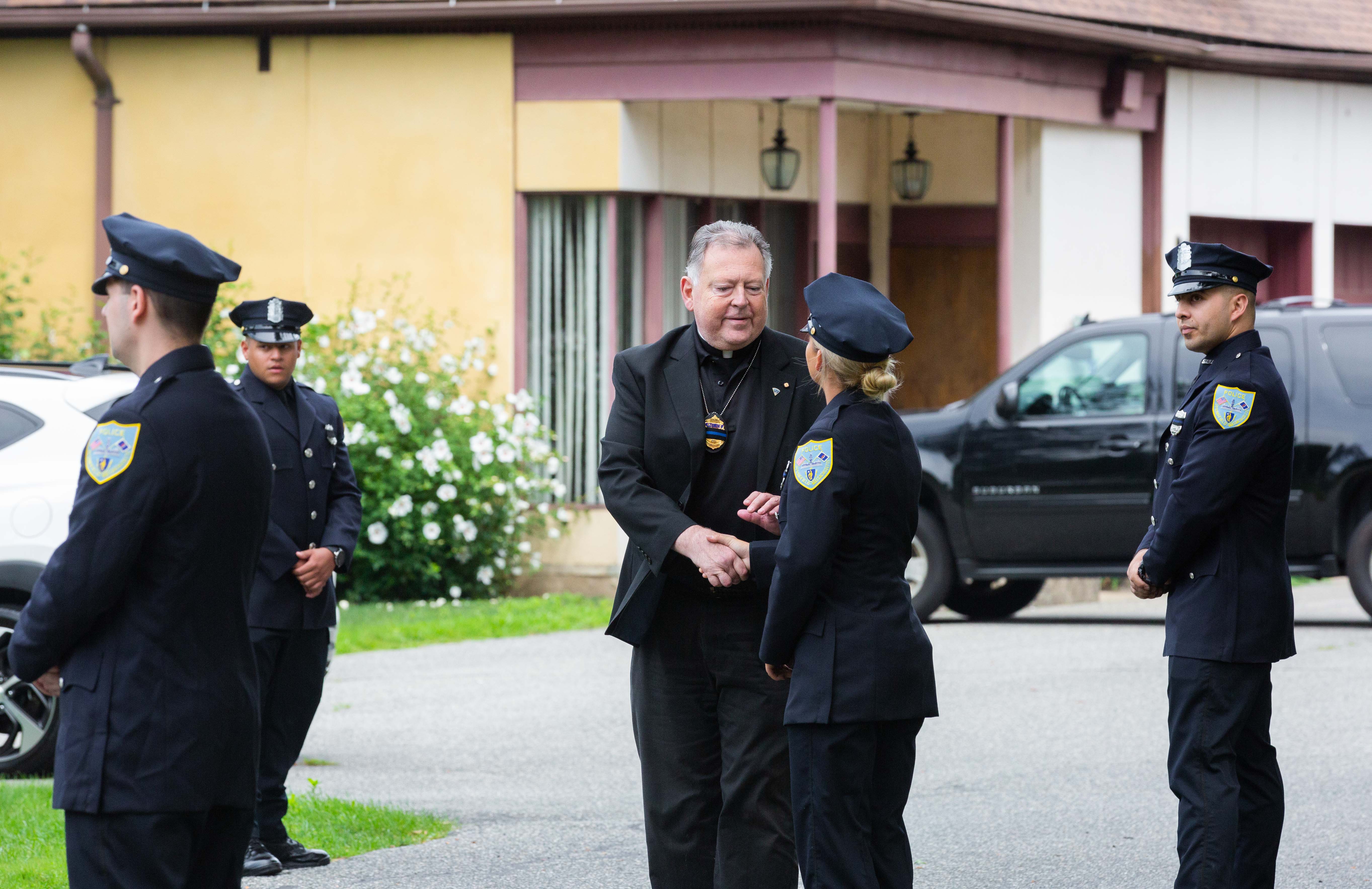 Springfield police escorted the body of deceased officer Aaron McNab ...