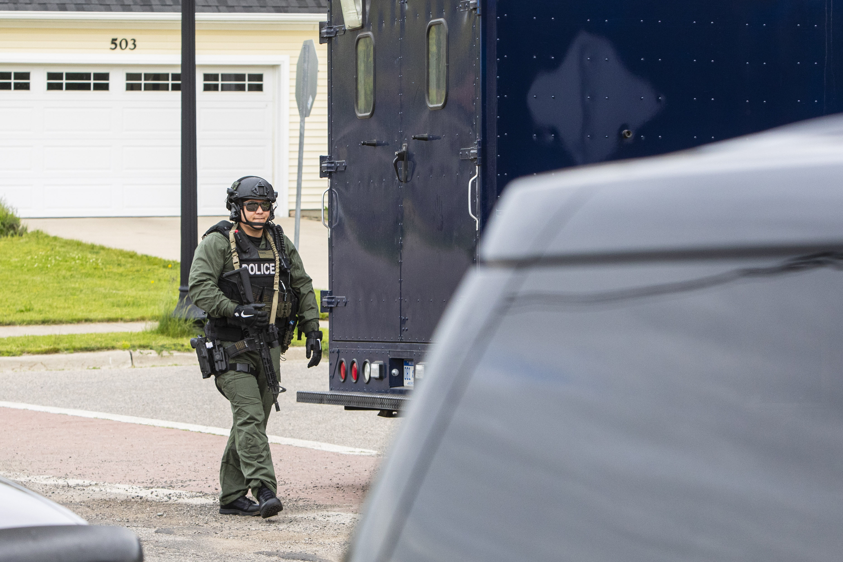 Police surround home on Kalamazoo's Southeast side - mlive.com