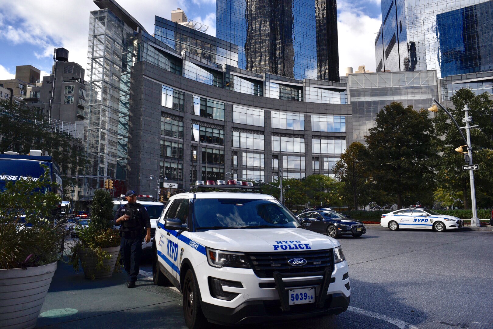 Law Enforcement officials respond to the scene of a suspicious package ...