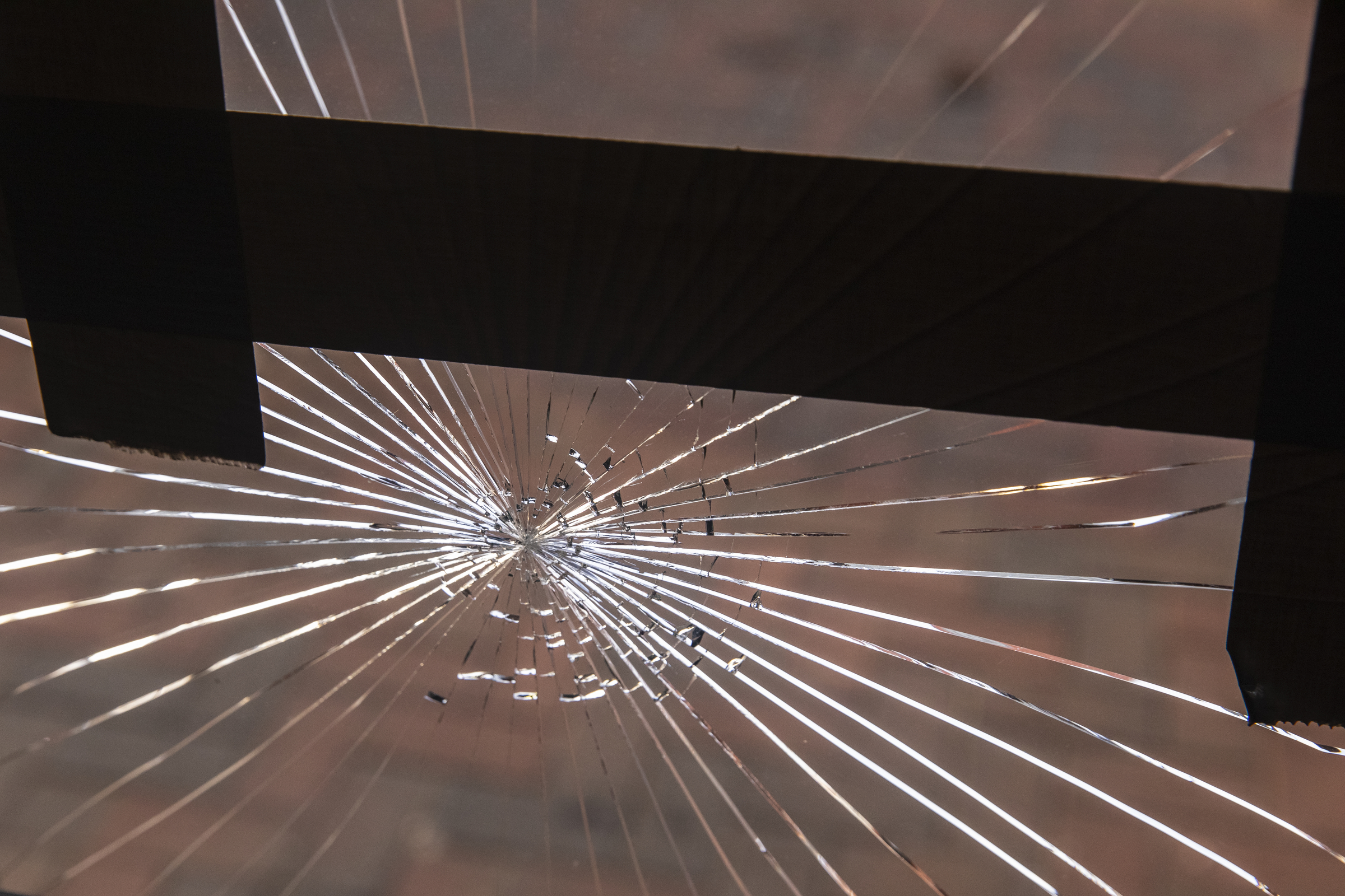 Woman arrested after breaking windows of several businesses in ...