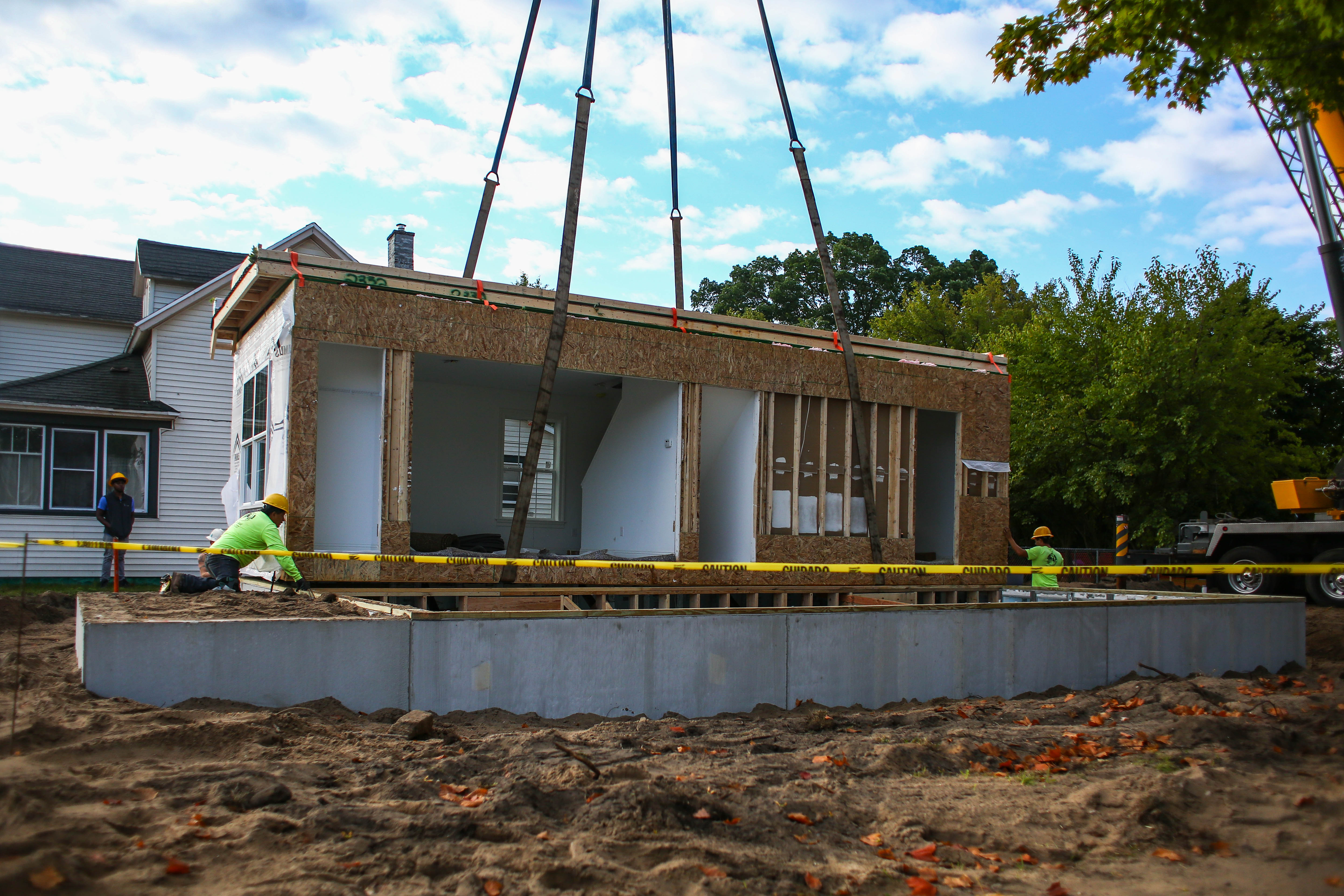 Crane lowers modular home onto foundation - mlive.com