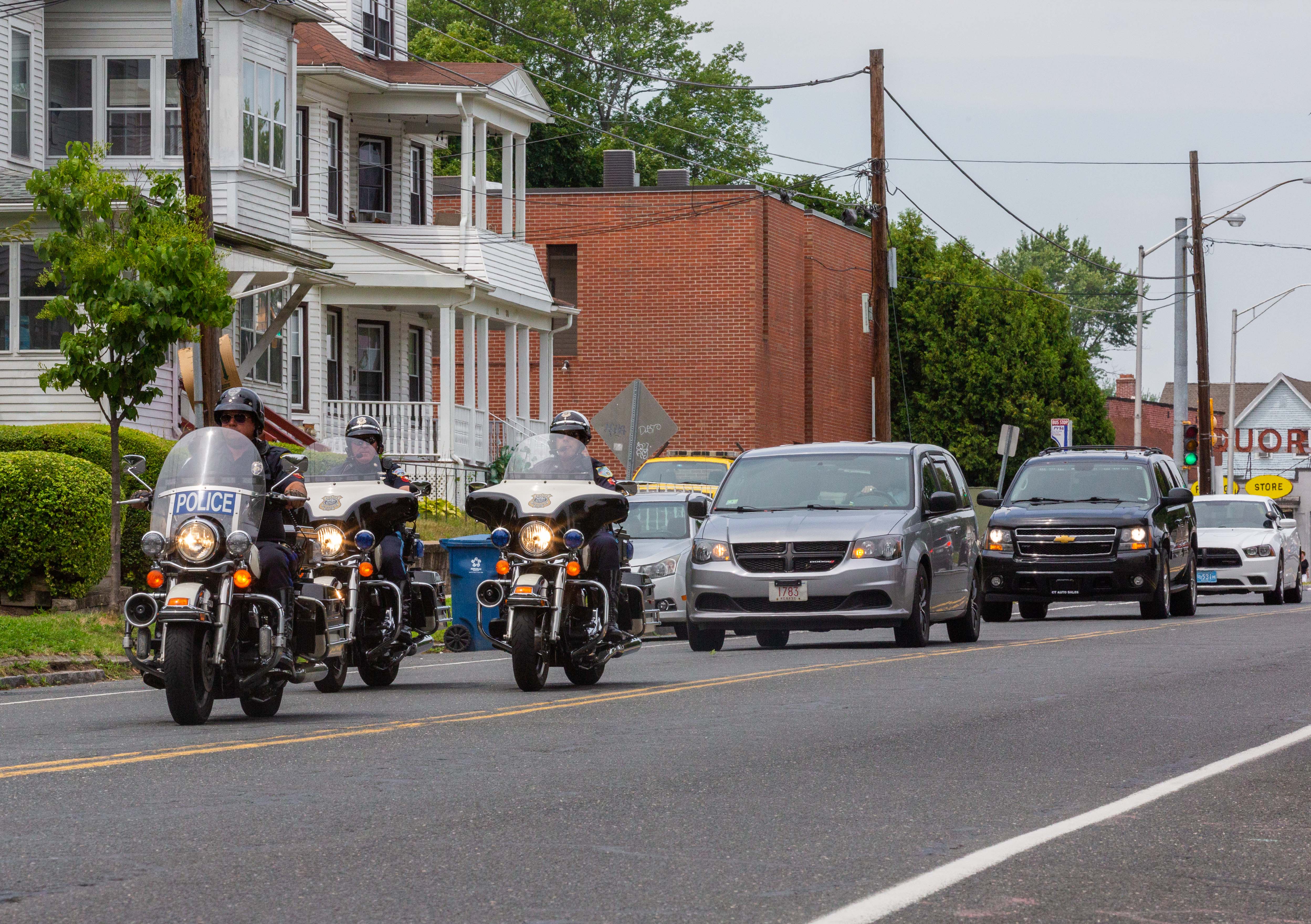Springfield police escorted the body of deceased officer Aaron McNab ...