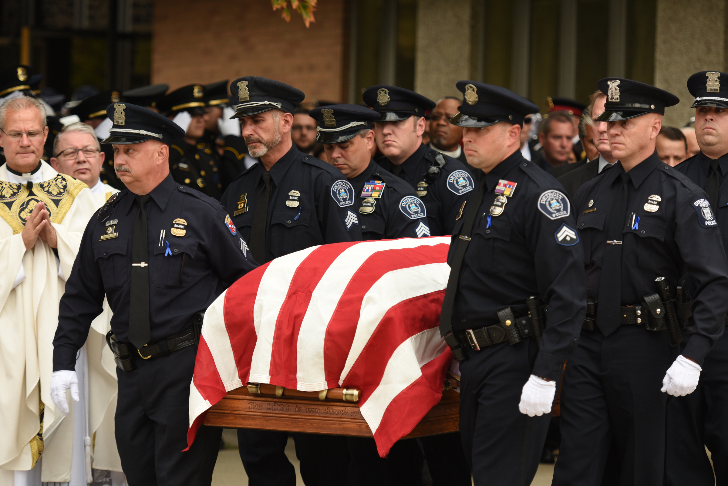 Detroit police Sgt. Kenneth Steil and Marquise Cromer - mlive.com