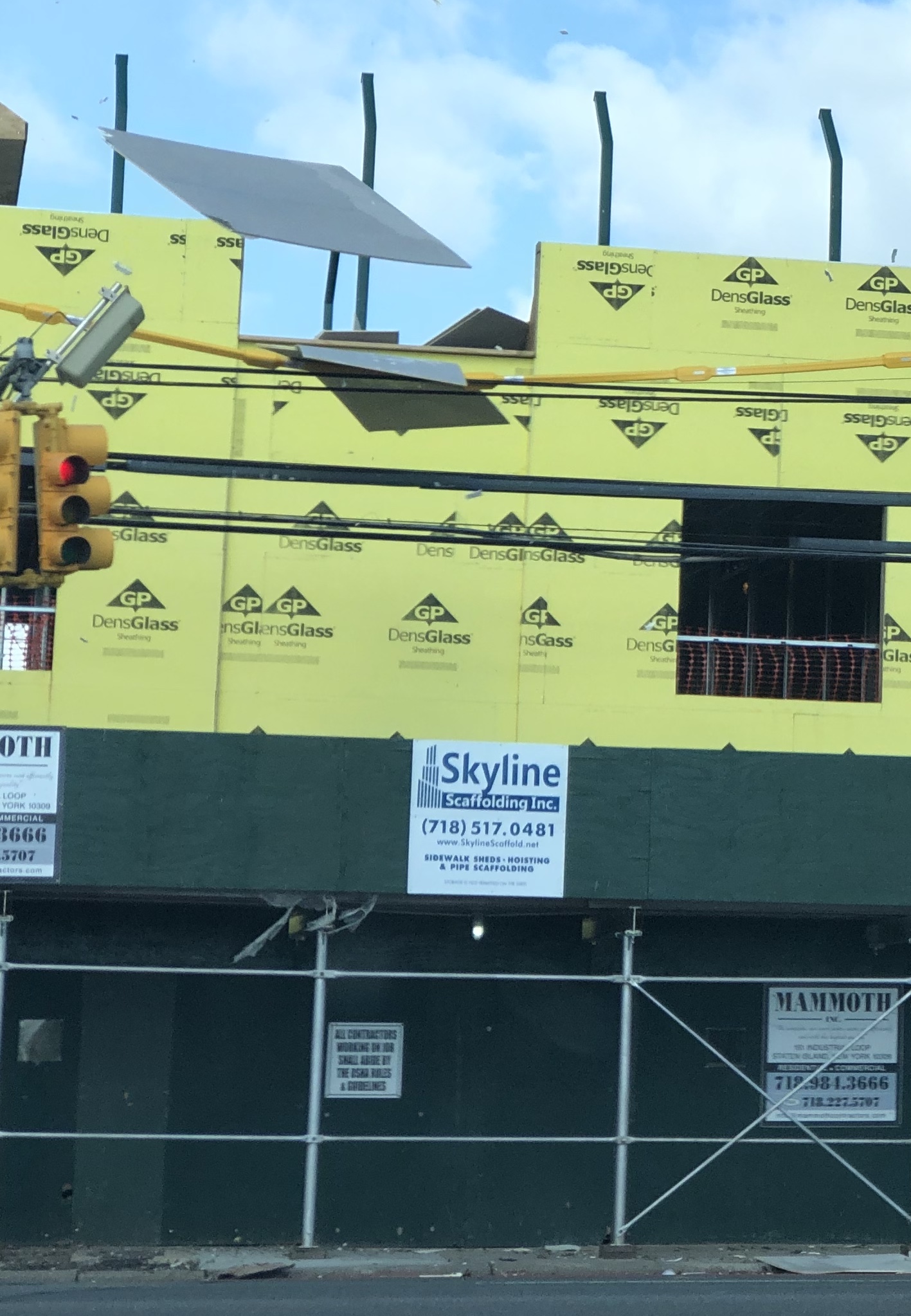 Strong winds blow boards off construction site roof - silive.com